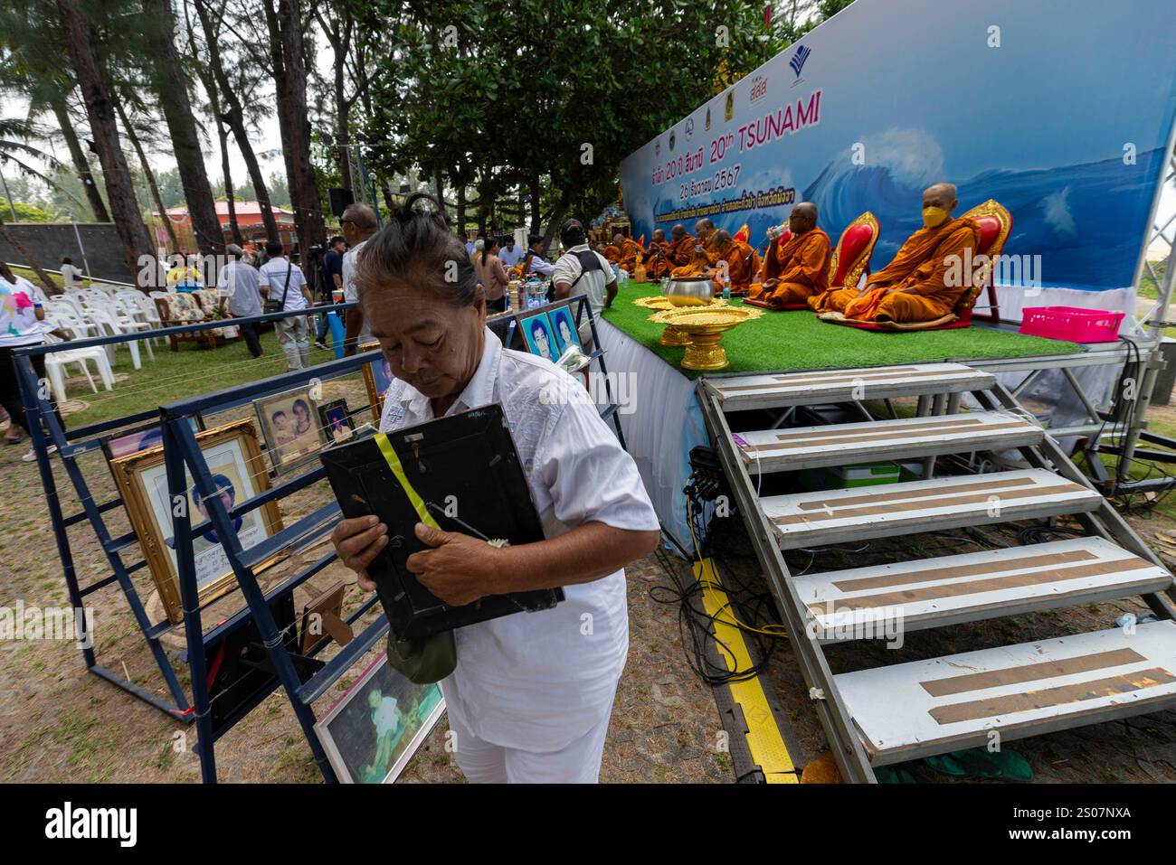 A relative of a victim of a 2004 Indian Ocean tsunami participates in ...
