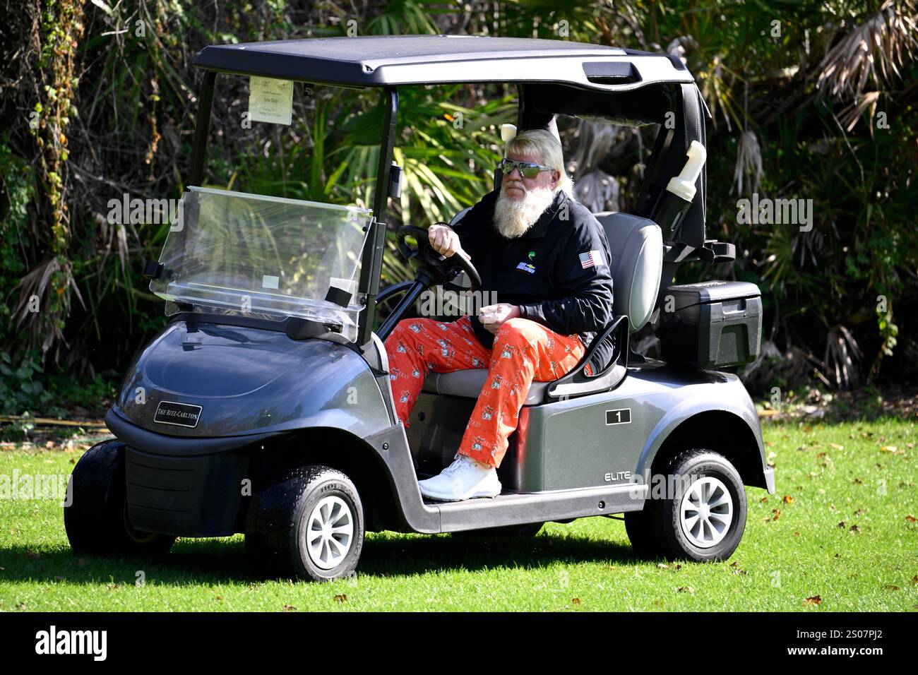 John Daly drives to the fourth hole during the first round of the PNC ...