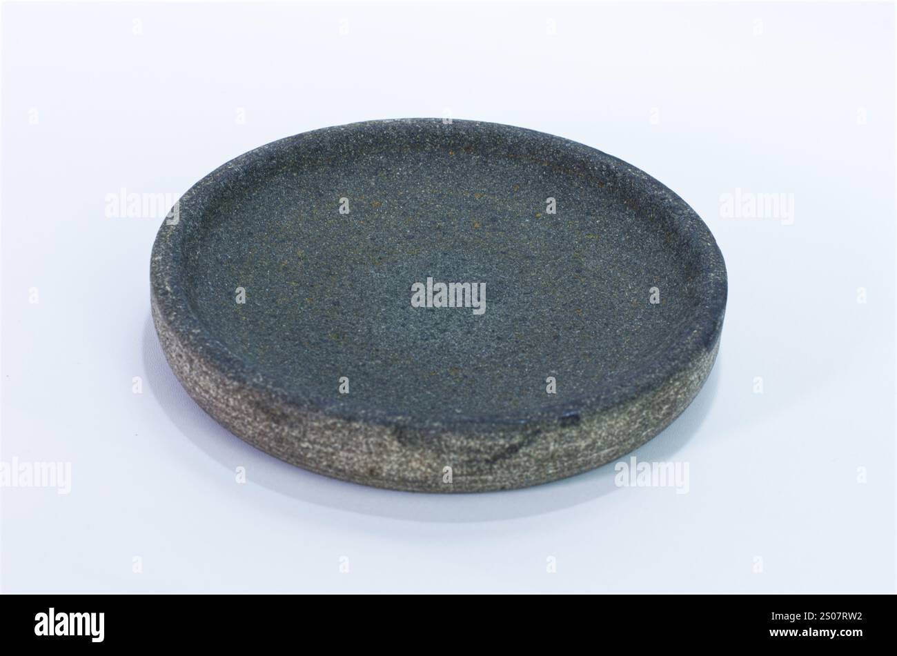 Traditional Stone Mortar and Pestle for Food Preparation on a White ...