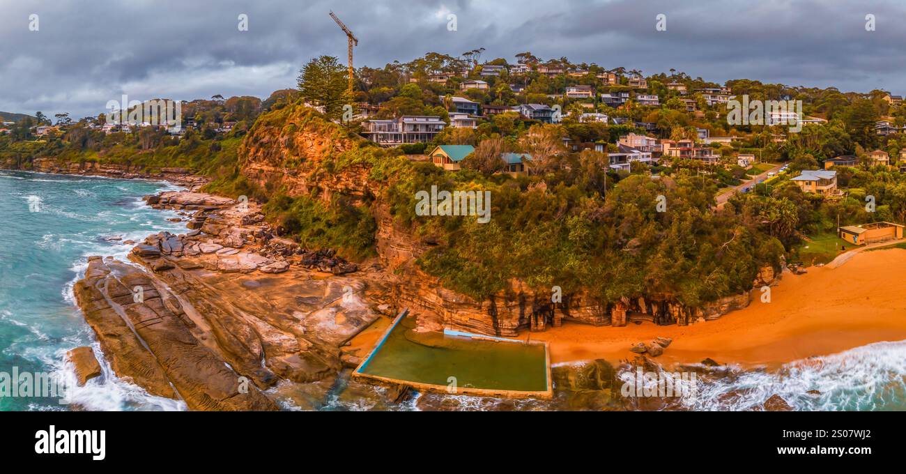 Aerial sunrise panorama over Whale Beach in the Northern Beaches region ...