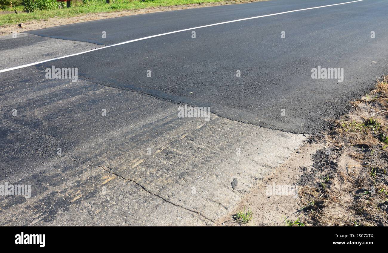 Road repair, renovation with laying new asphalt Stock Photo - Alamy