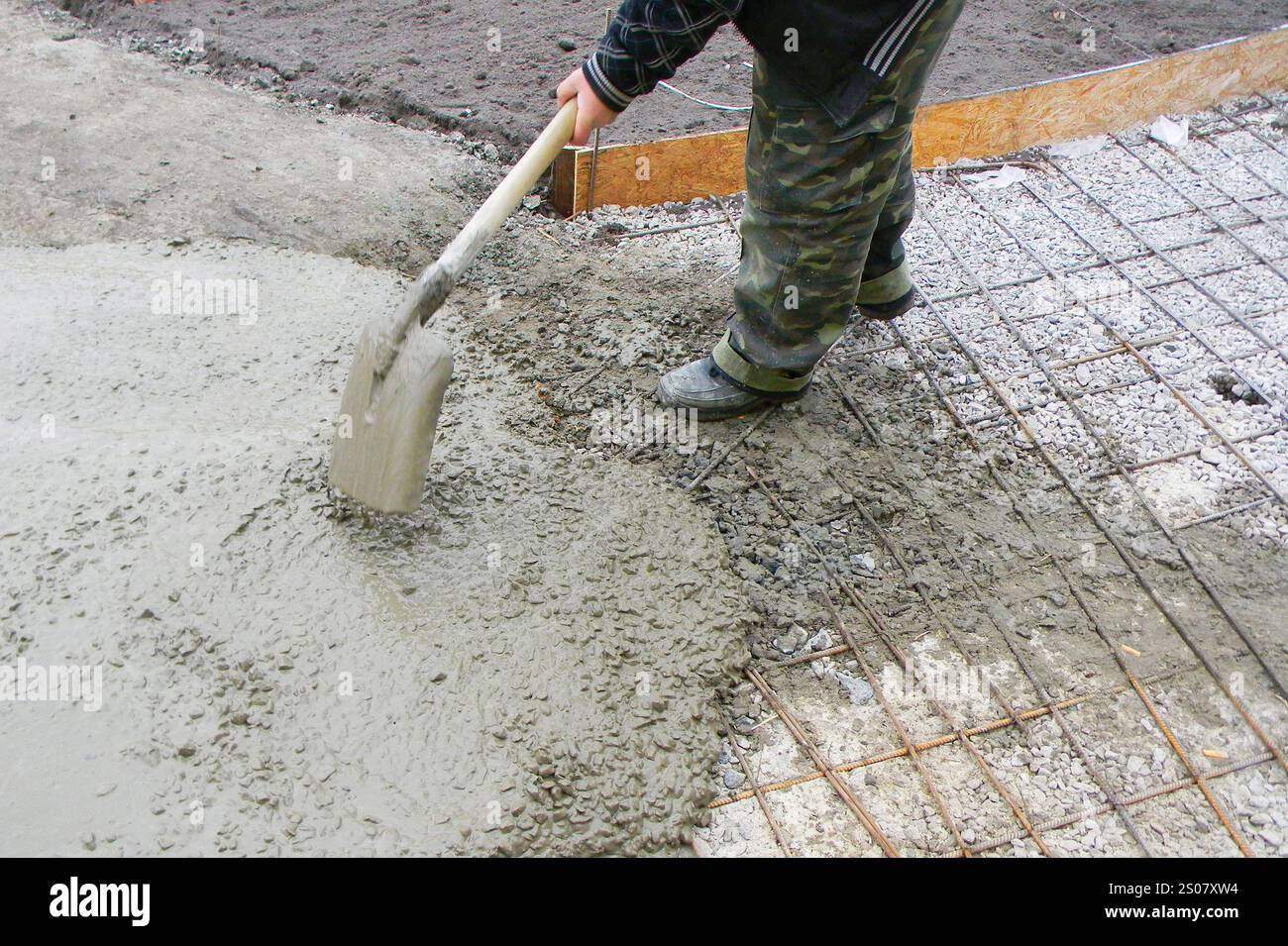 Concrete pavement base with reinforcement. This is done by laying down ...