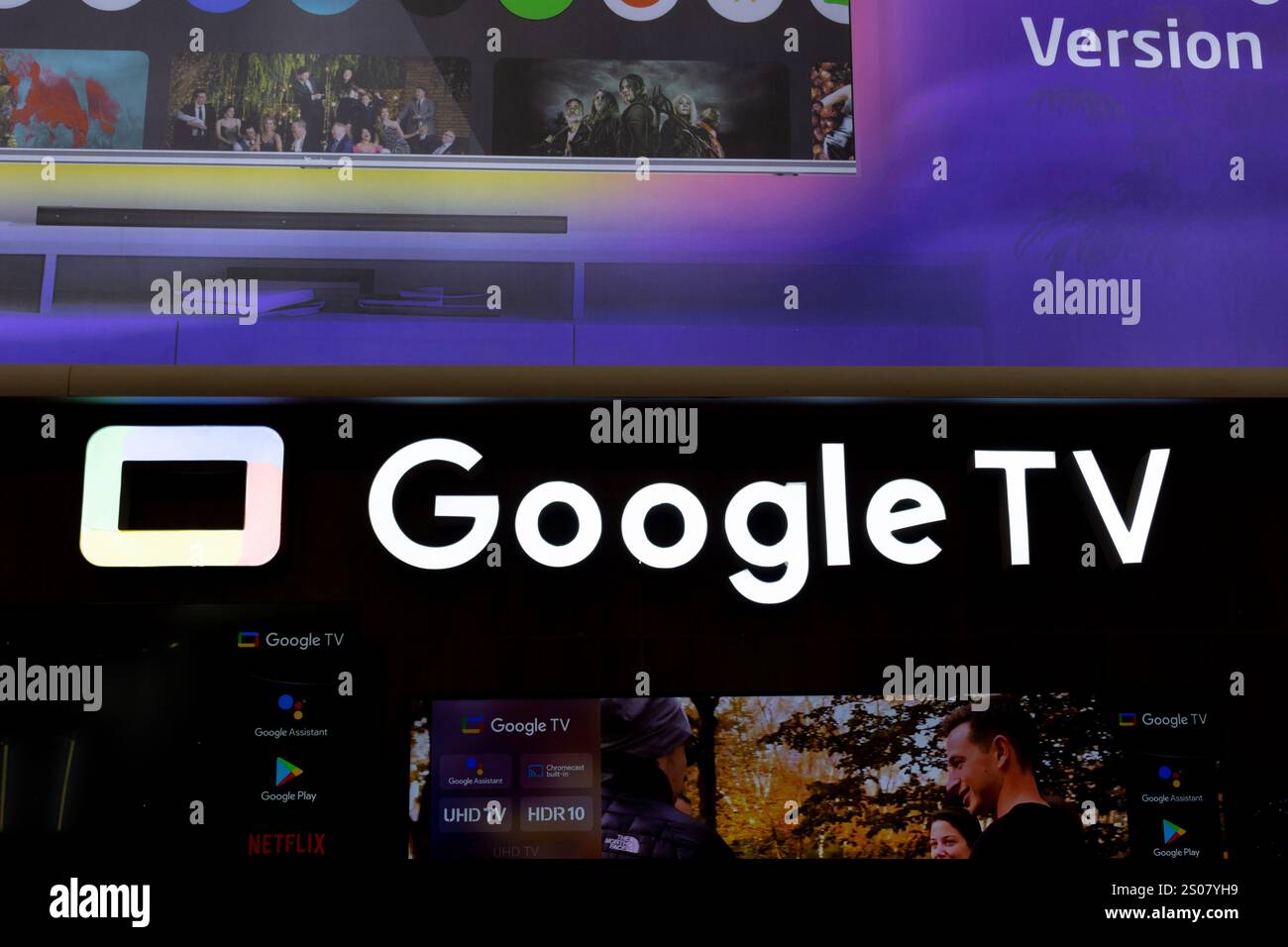 Google TV sign on the wall Stock Photo - Alamy
