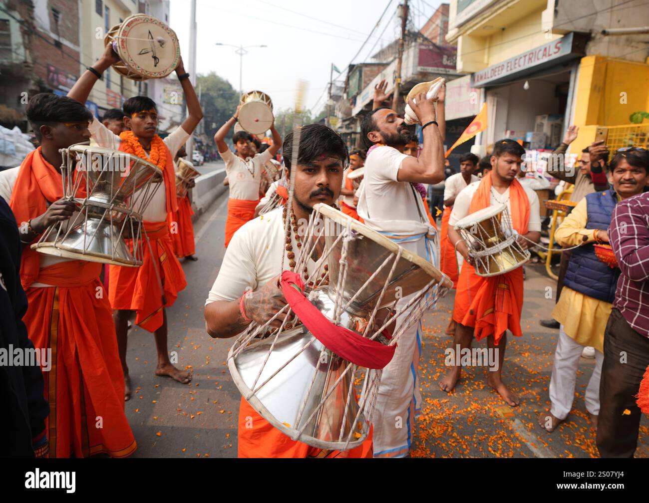Hindu devotees play drums during procession of Shree Panchagni Akhada ...