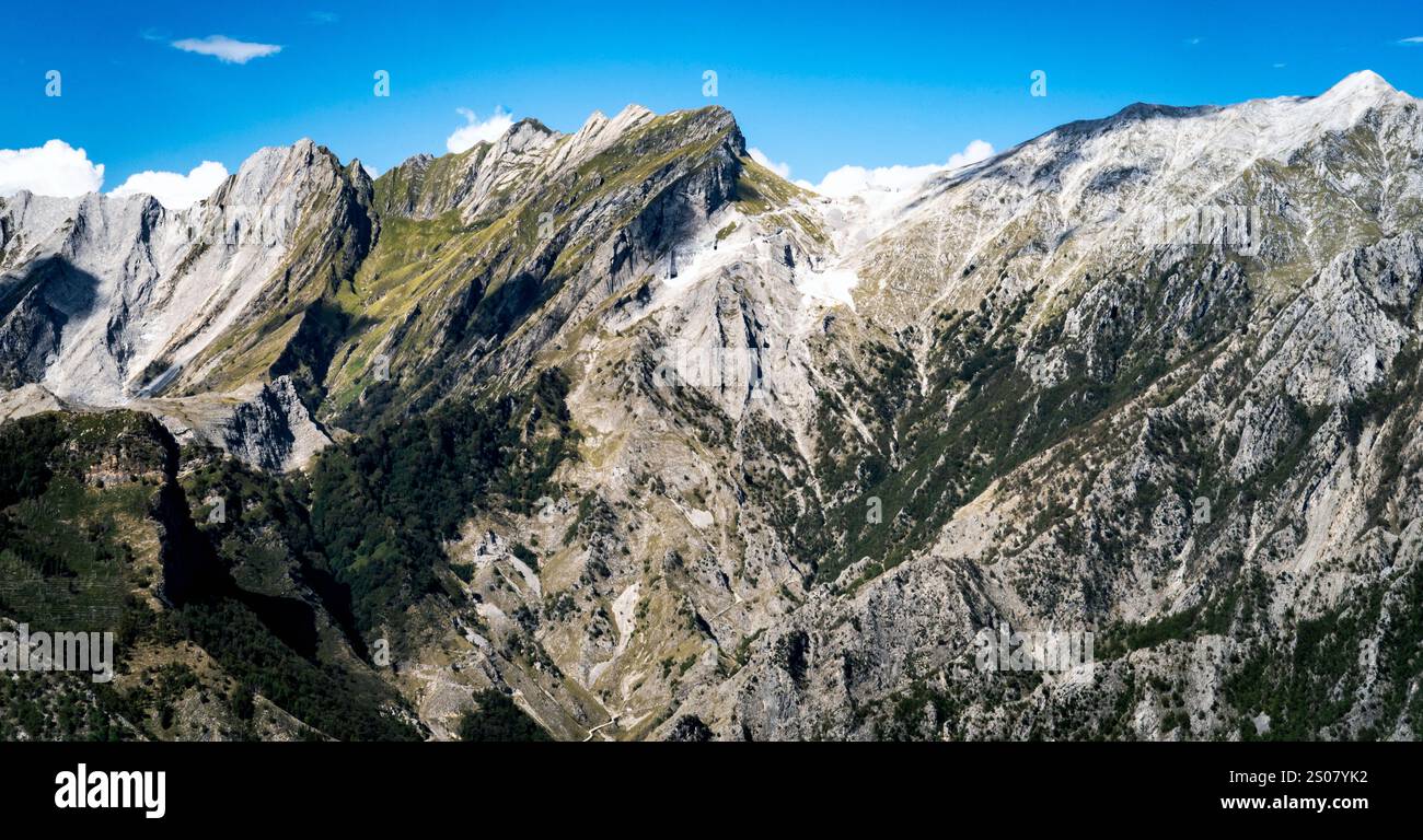 A breathtaking view of rugged mountain peaks under a clear blue sky ...
