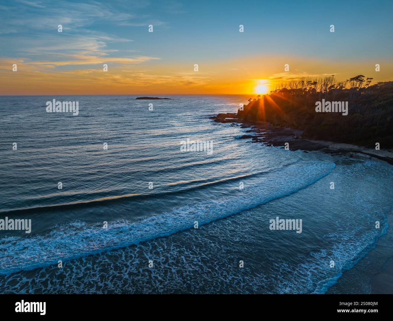 Early morning aerial views over the sea and lagoon at Lilli Pilli Beach ...