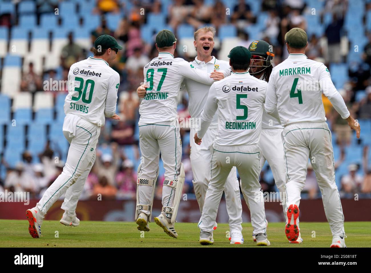 South Africa's Corbin Bosch, centre, celebrates with teammates after ...