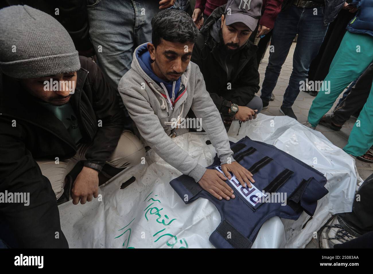 Relatives of 5 photojournalists Ayman al-Jedy and journalists Faisal ...