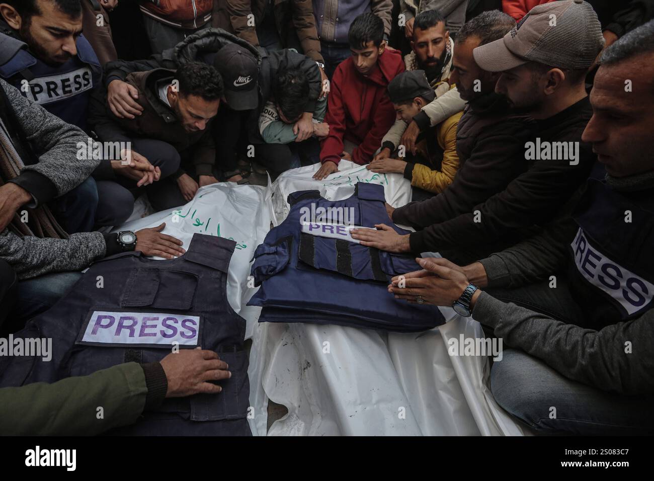 Relatives of 5 photojournalists Ayman al-Jedy and journalists Faisal ...