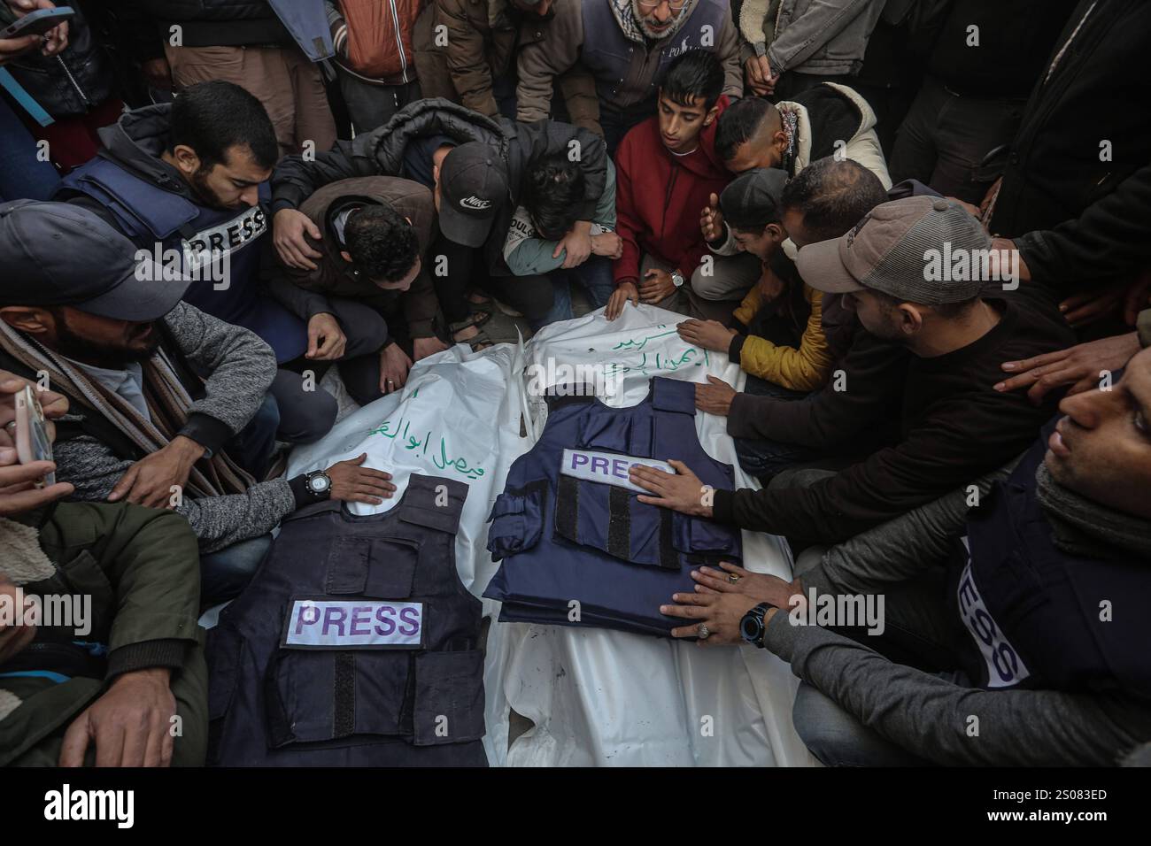 Relatives of 5 photojournalists Ayman al-Jedy and journalists Faisal ...