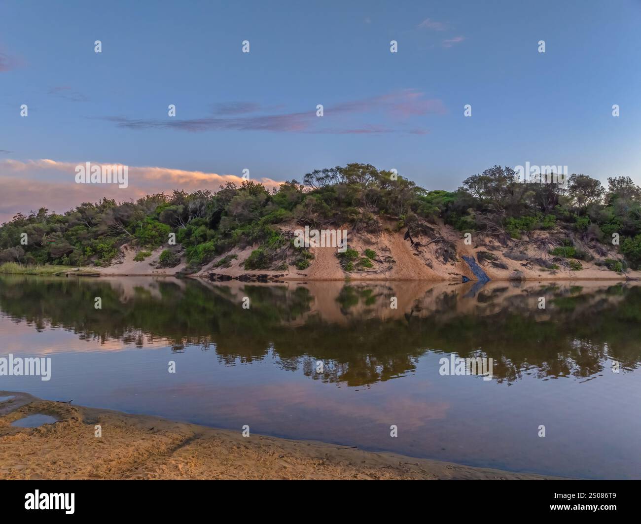 Aerial sunrise over the lagoon and beach at Wamberal on the Central ...