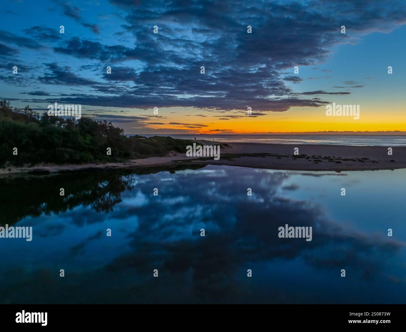 Aerial sunrise over the lagoon and beach at Wamberal on the Central ...
