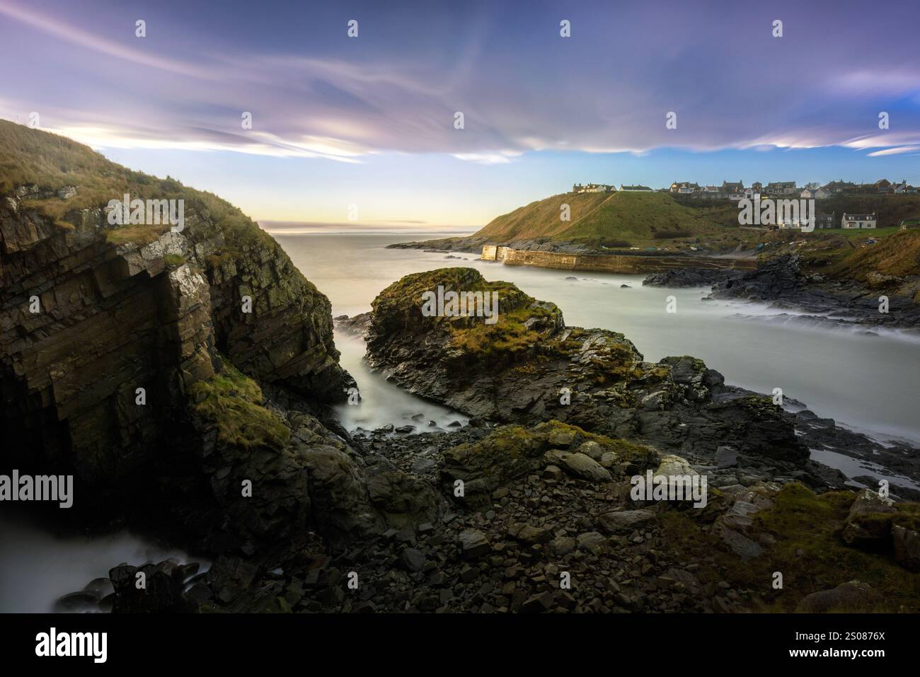 The rugged coastline at the small fishing village Collieston in ...