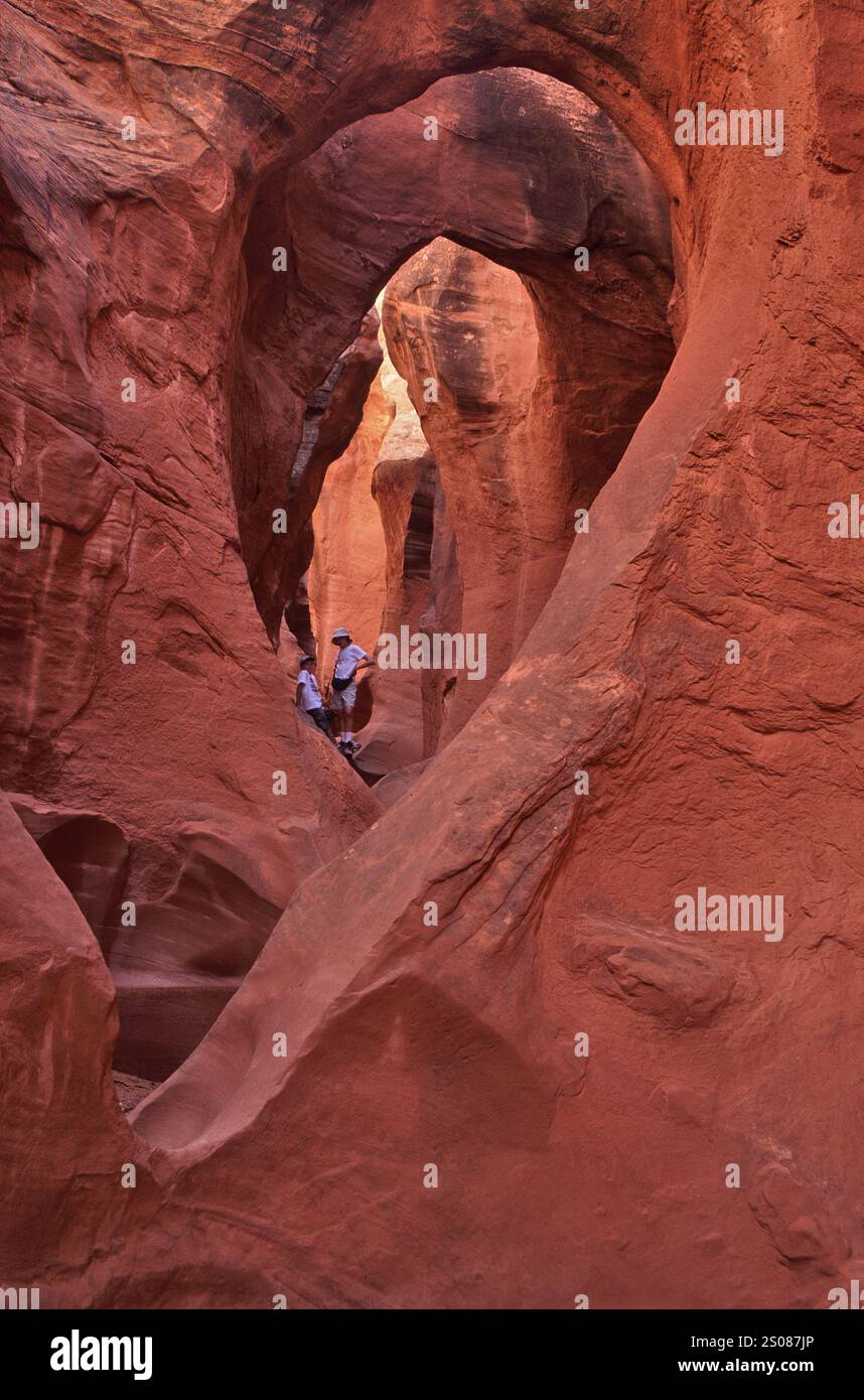 Children hiking at Peek-A-Boo Gulch, off Hole-in-the-Rock Road, Grand ...