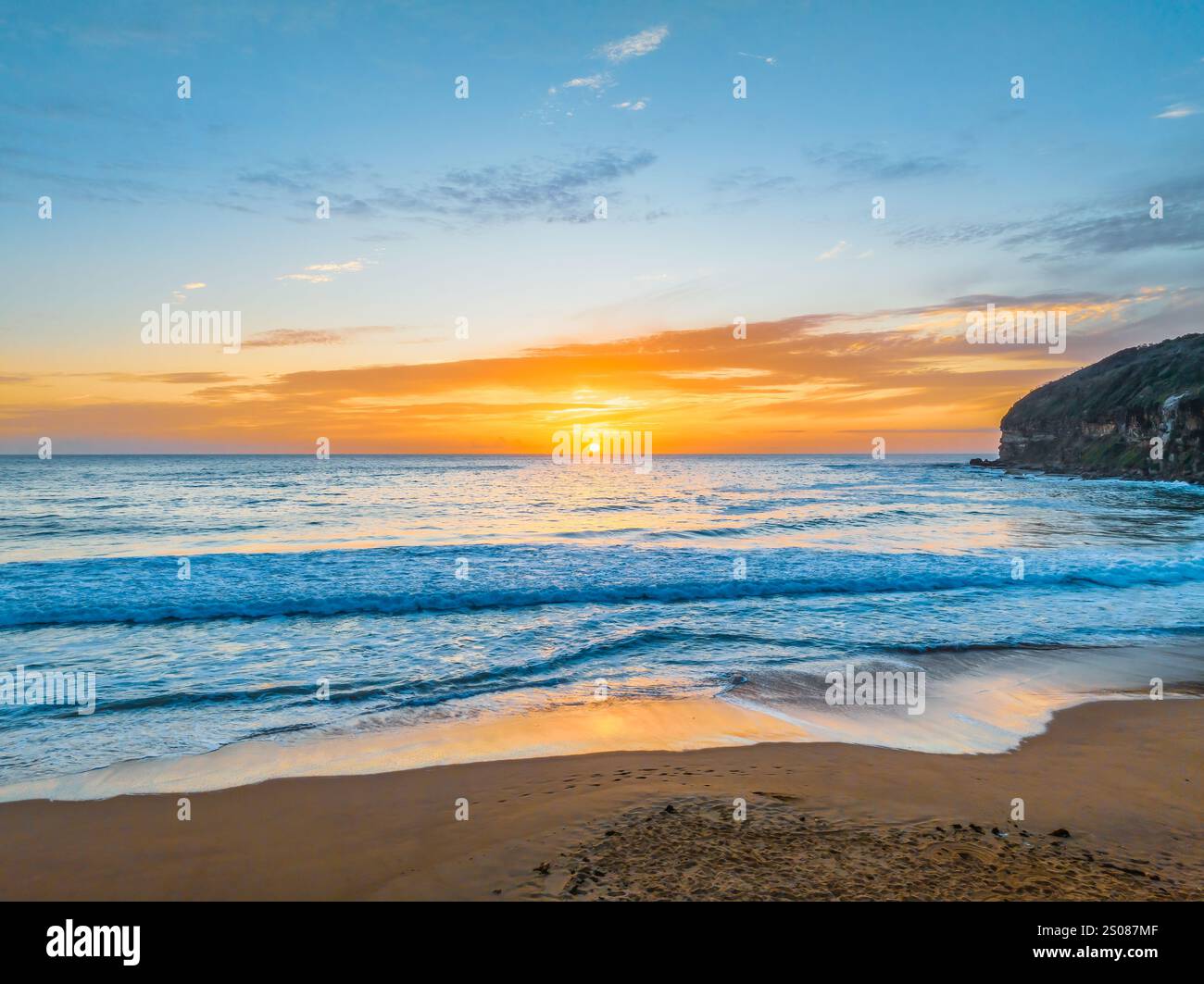 Aerial sunrise with pretty clouds and waves at Macmasters Beach on the ...