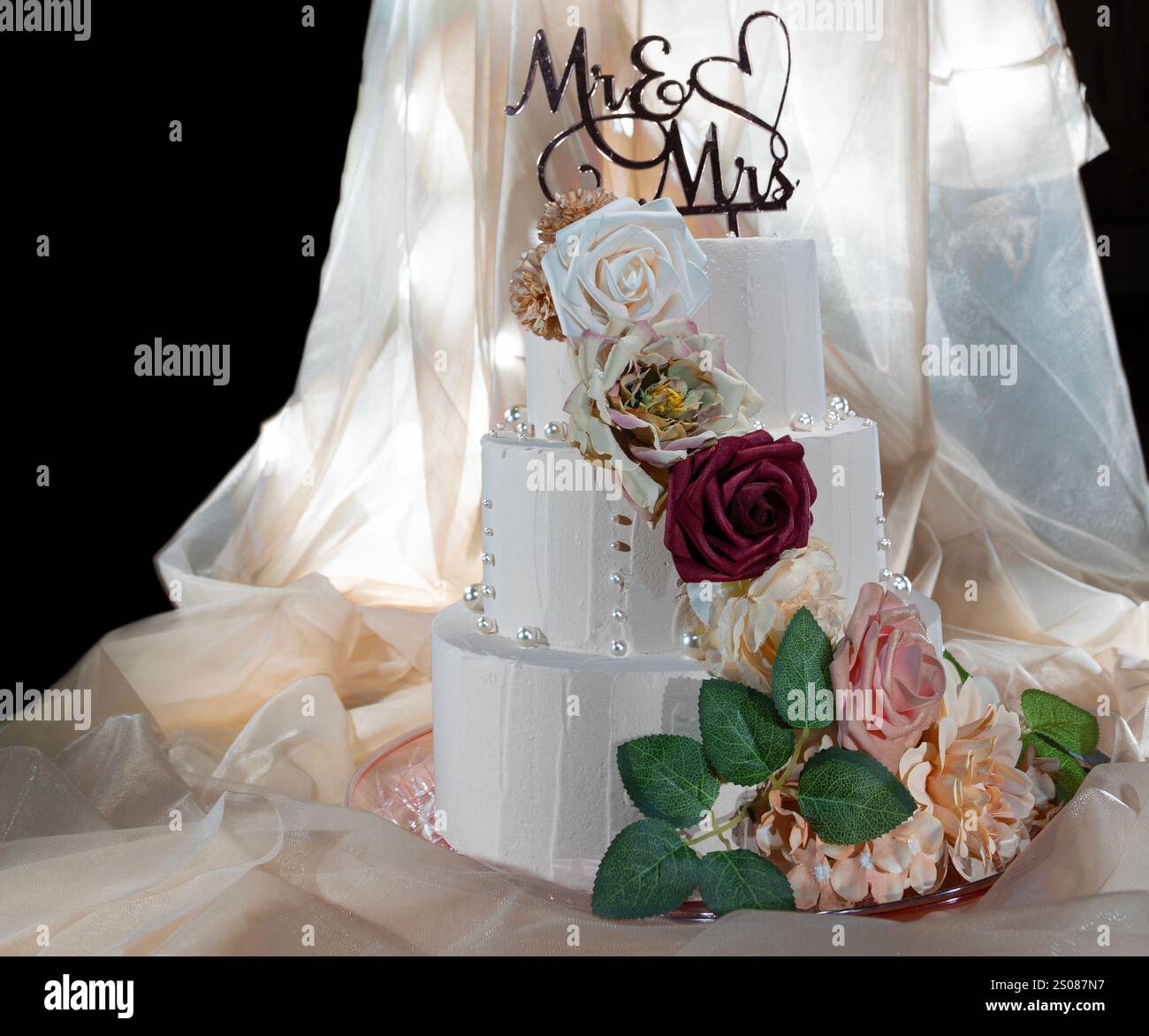 Fake white wedding cake with roses with a bright pink and lacey ...