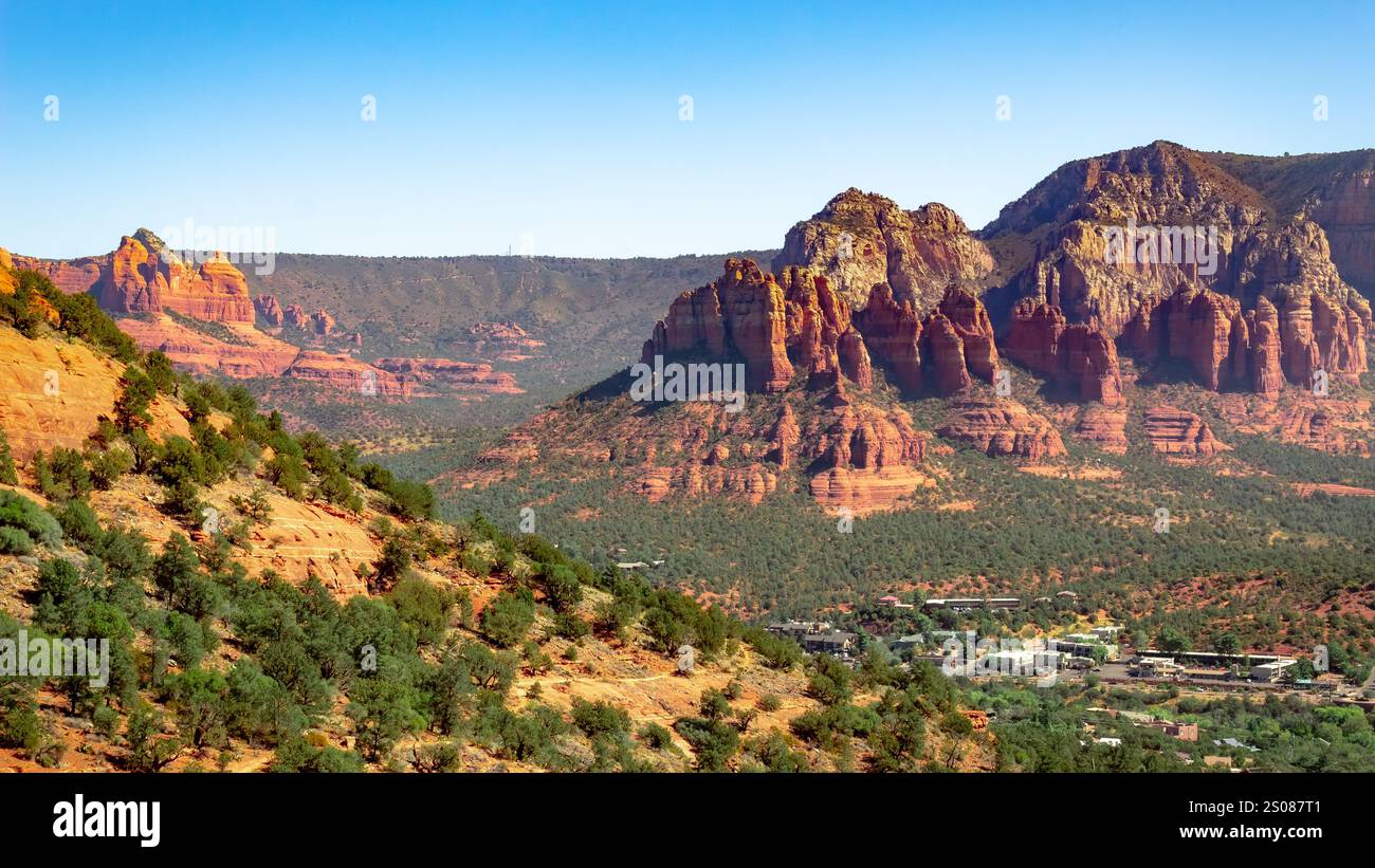 Red rock cliff and mountain and forest view on a dirt hiking trail at ...