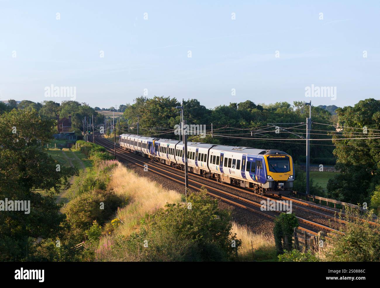 Northern Rail class 195 CAF diesel multiple unit on the electrified 2 track west coast mainline ...