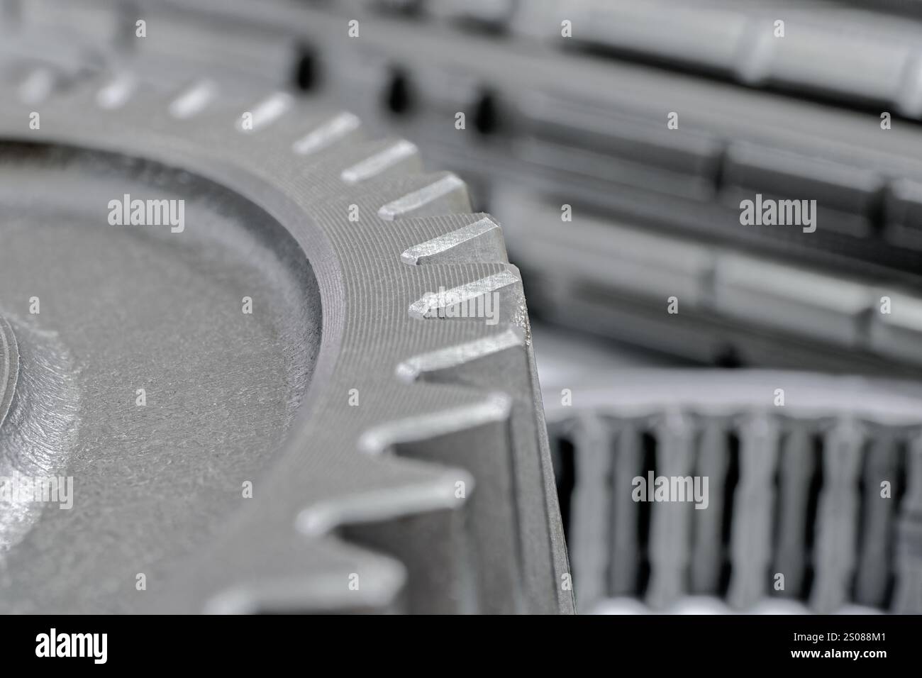 Assorted steel gearwheels and shafts, parts of gear transmission, close ...