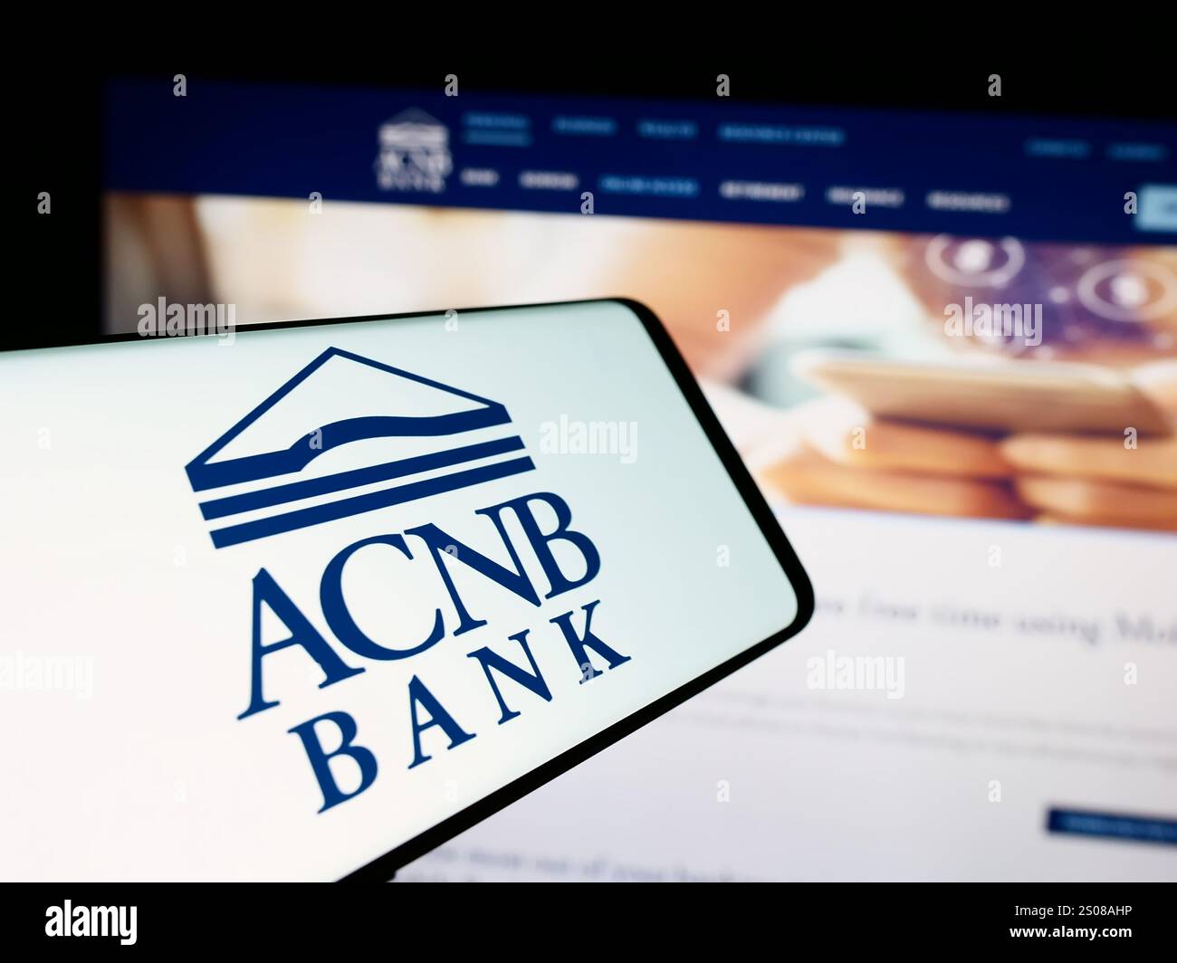In this photo illustration, a cellphone with the logo of American ...