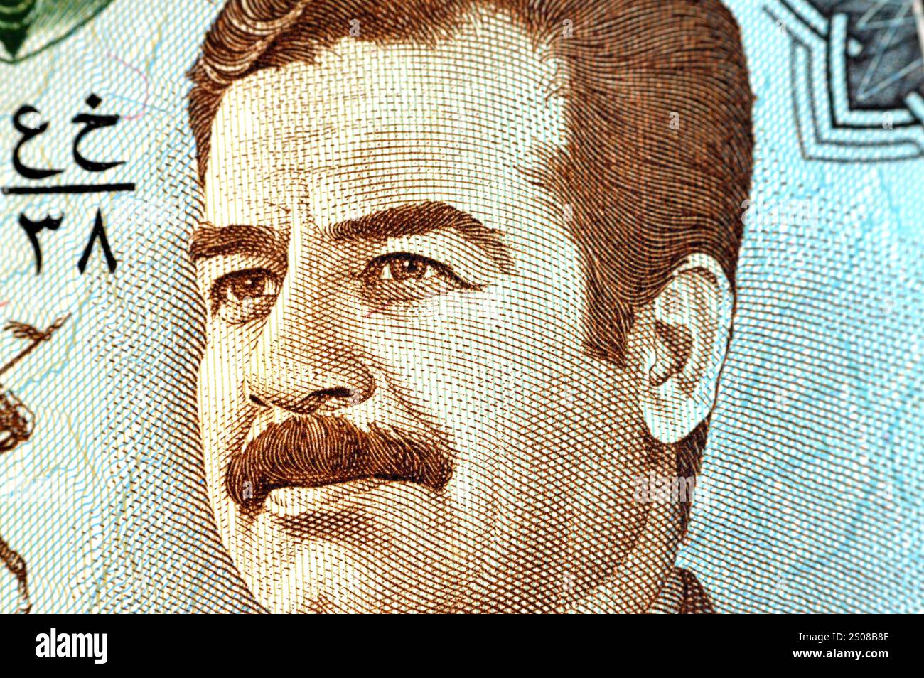 Saddam Hussein in uniform from the obverse side of Iraqi twenty five ...