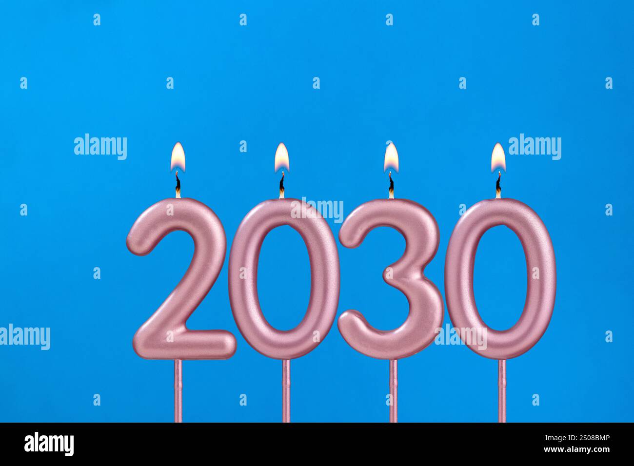 Happy new year 2030 - Candles in the shape of a number on a blue ...