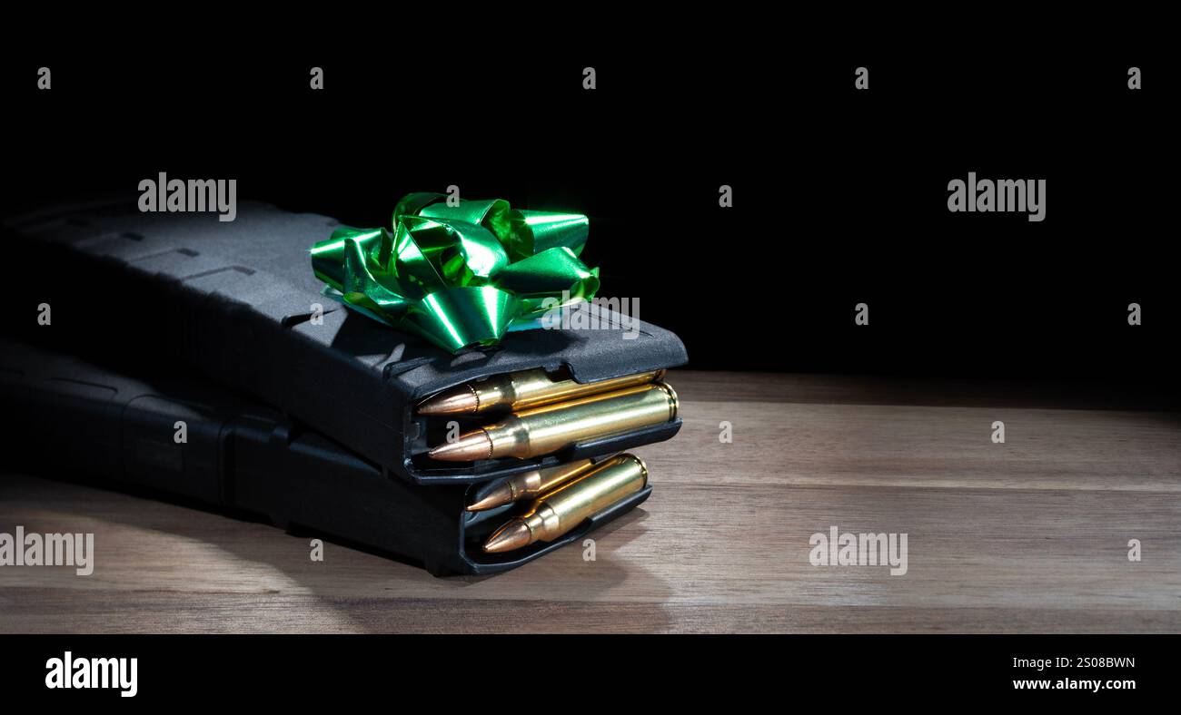 Loaded AR-15 high capacity magazines as a gift with a green bow on top ...