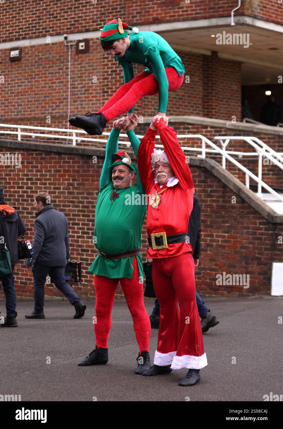 Performers dressed as Santa and his elves on King George VI Chase Day ...