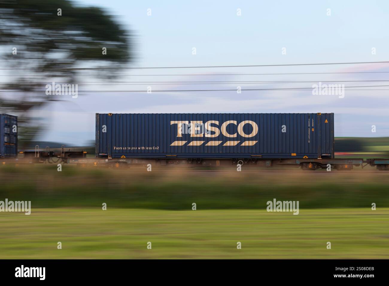 Tesco intermodal container being carried on a freight train at high ...