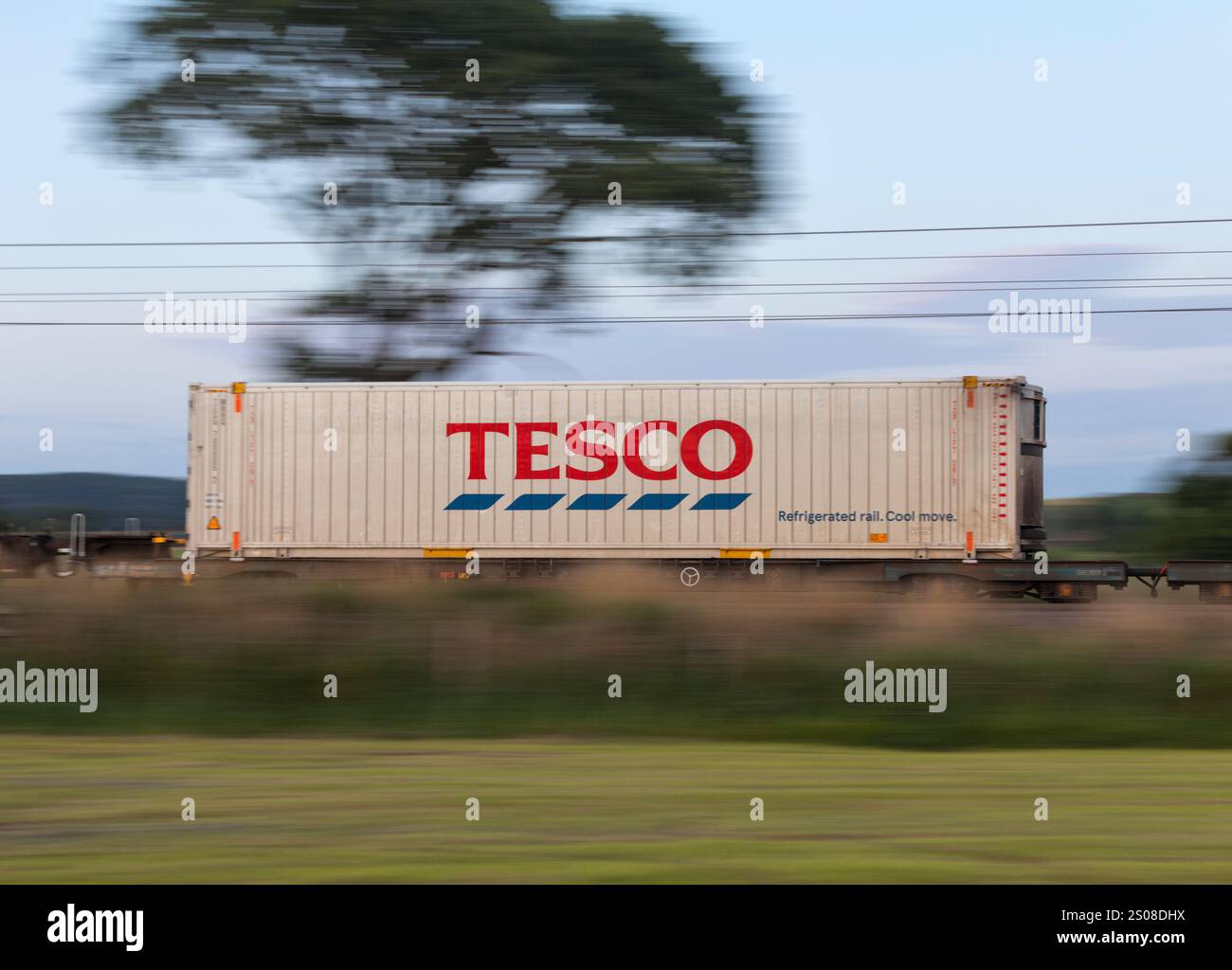 Tesco intermodal container being carried on a freight train at high ...