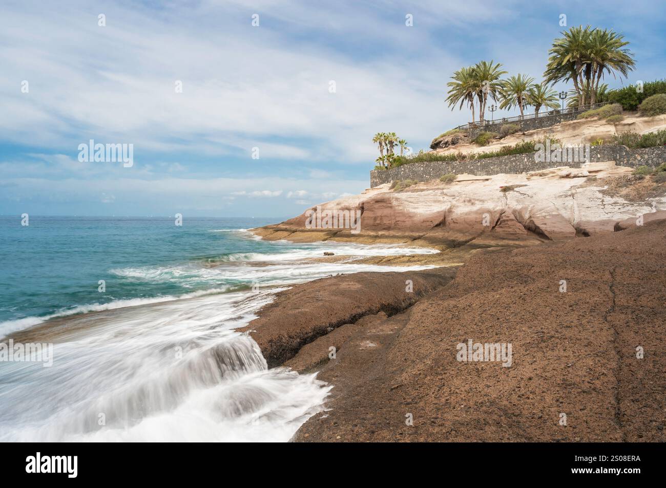 The exotic shoreline of Tenerife, Spain. The atlantic ocean washes over ...