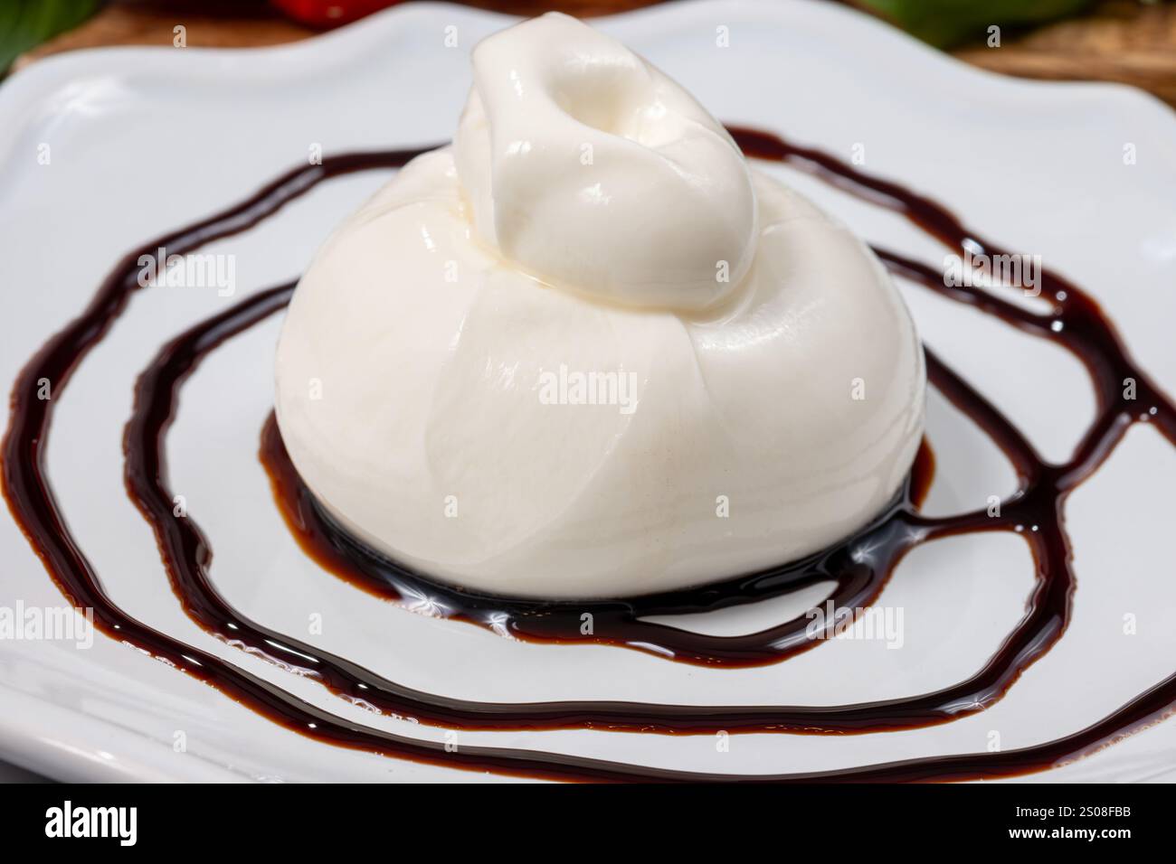 Eating of fresh soft Italian cheese, white balls of burrata or ...