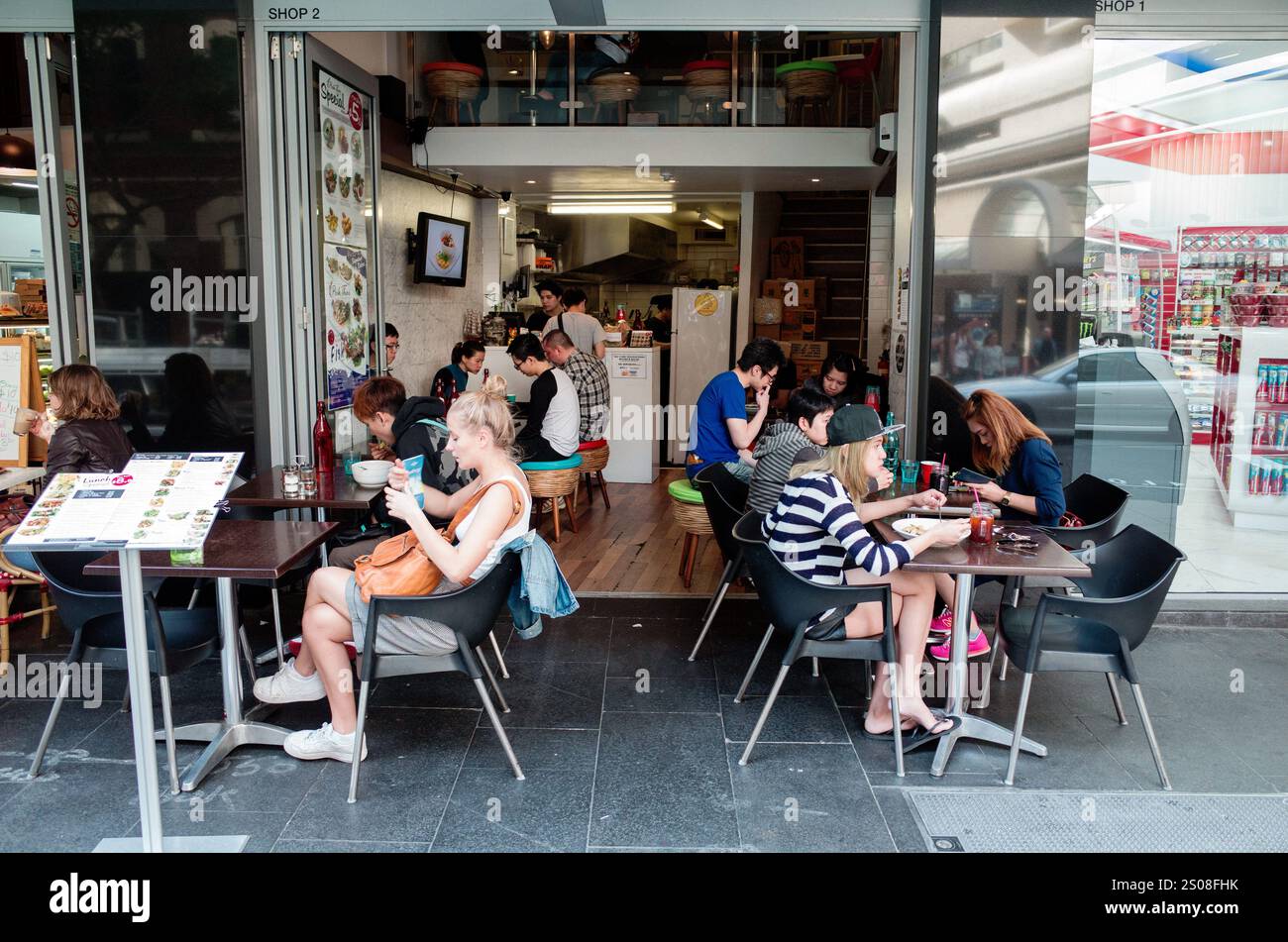 Editorial image of a modern cafe in Sydney, featuring both indoor and ...