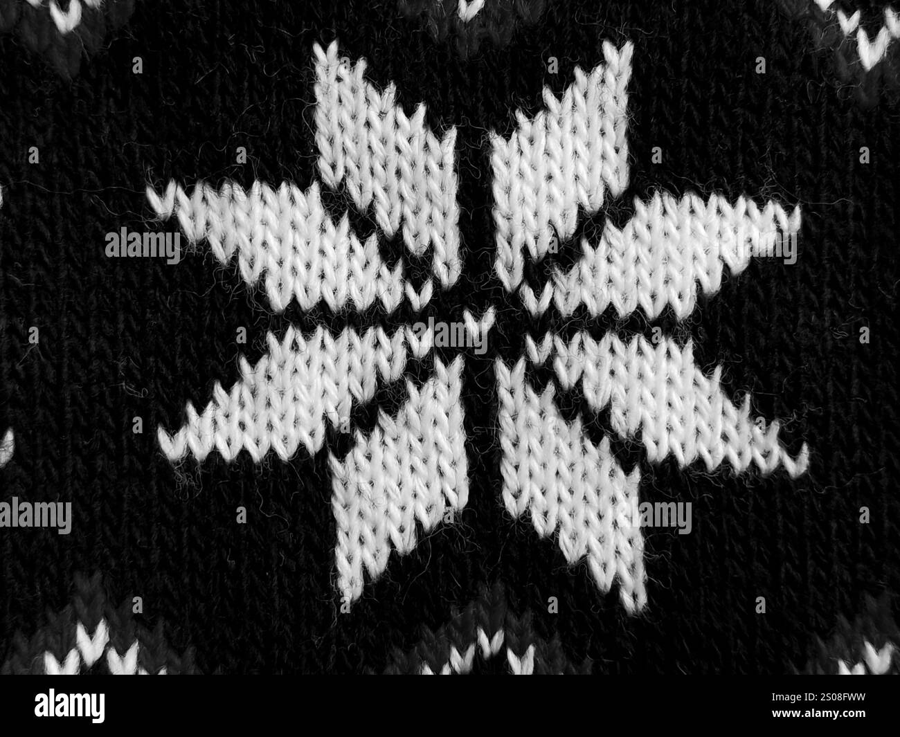 This intricate winter knitting pattern showcases a striking symmetrical ...