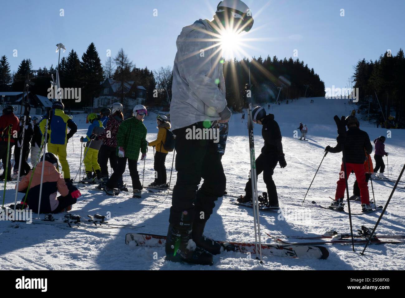 Altenberg, Germany. 26th Dec, 2024. Winter sports enthusiasts wait at a ...
