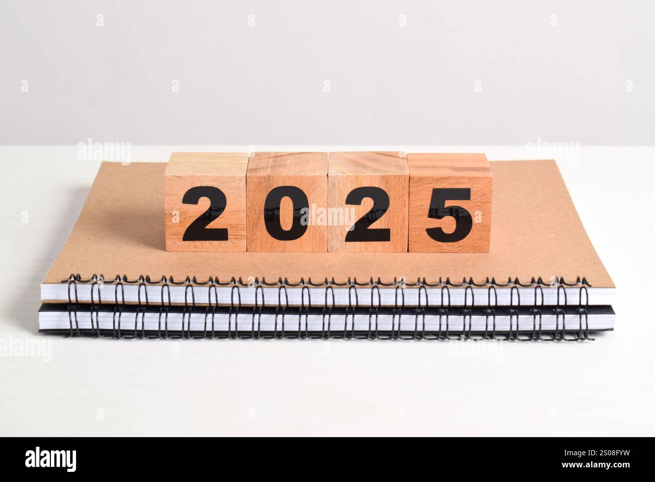 Planning 2025 trends new year symbol. 2025 Concept on wooden blocks and books on white ...