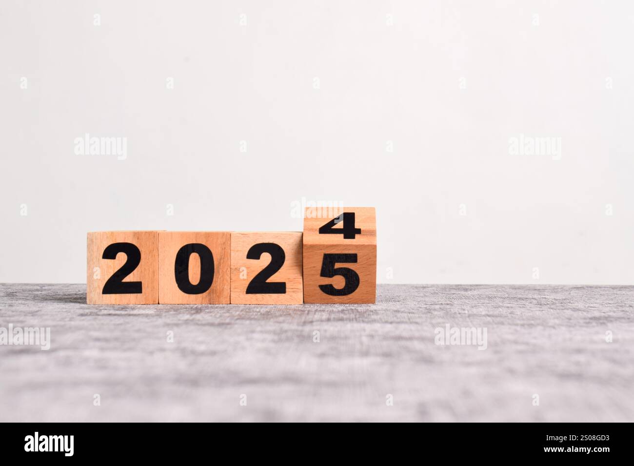 2025 Happy New Year. Wooden cube block change from 2024 to 2025 ...