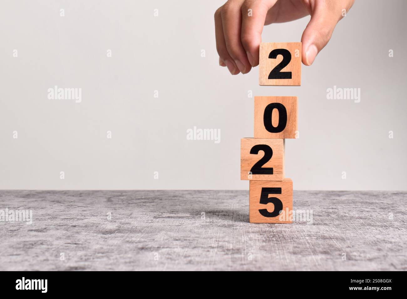 Starting new year 2025. Flipping of 2024 to 2025 on wooden cube blocks ...
