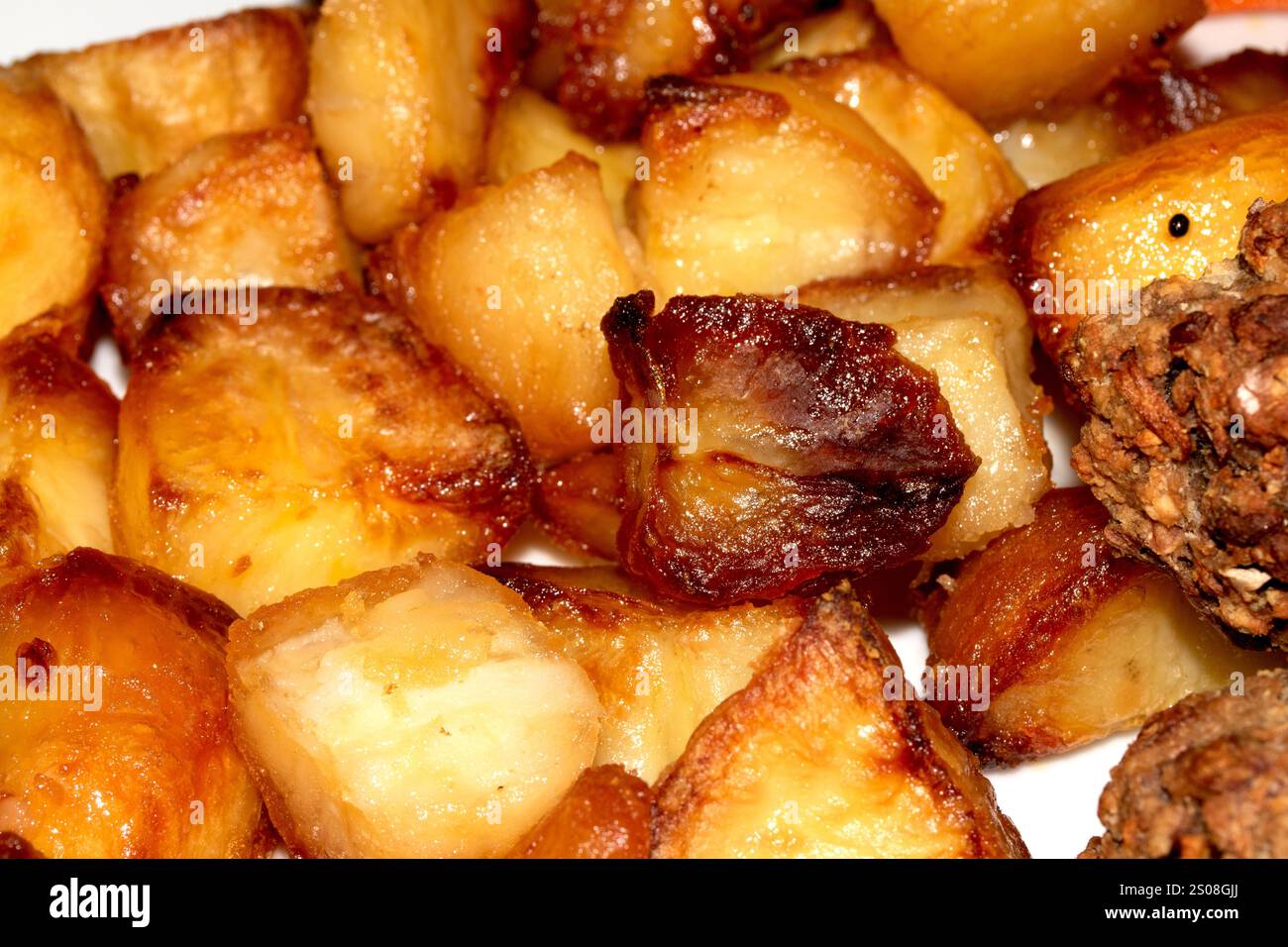 Close Up of Golden Roast Potatoes Cooked Stock Photo - Alamy