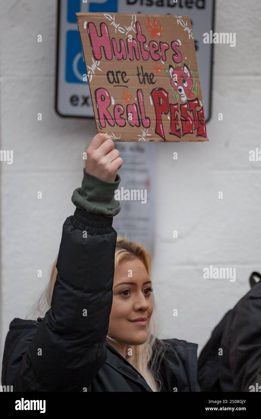 LEOMINSTER, UK - DECEMBER 26, 2024; A protestor holds aloft a placard ...