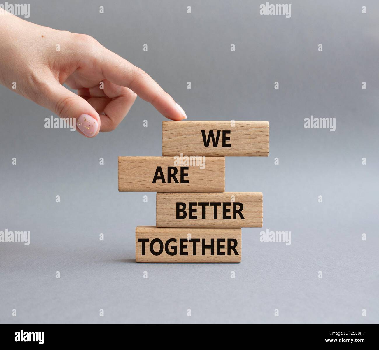 We are better together symbol. Wooden blocks with words We are better ...