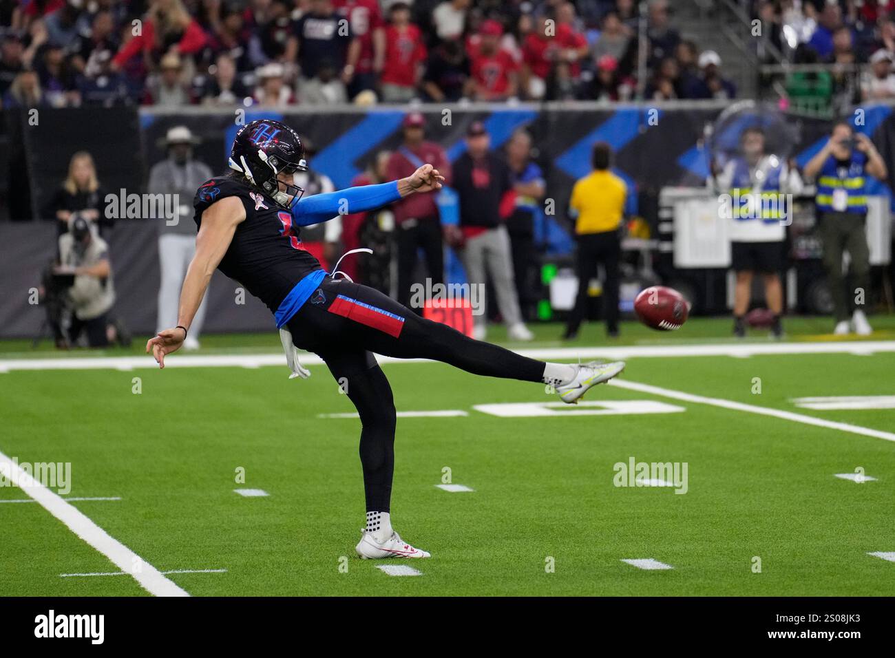 Houston Texans punter Tommy Townsend punts the ball against the ...