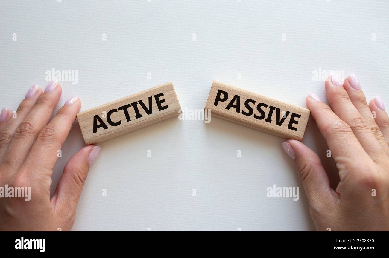 Active or Passive symbol. Concept word Active or Passive on wooden ...