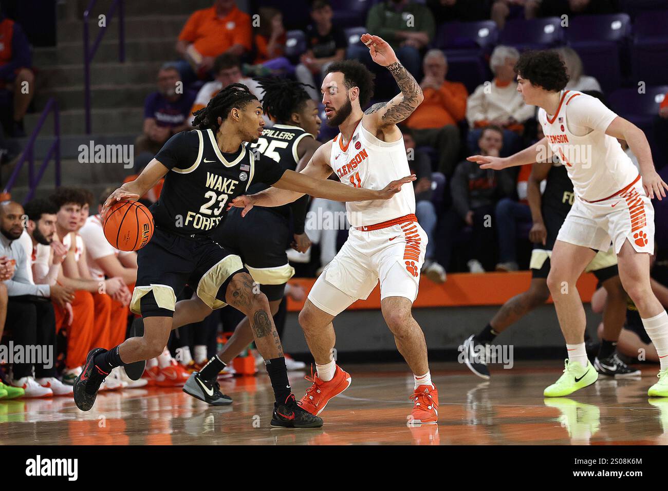 CLEMSON, SC - DECEMBER 21: Wake Forest Demon Deacons guard Hunter Sallis (23) defended by ...
