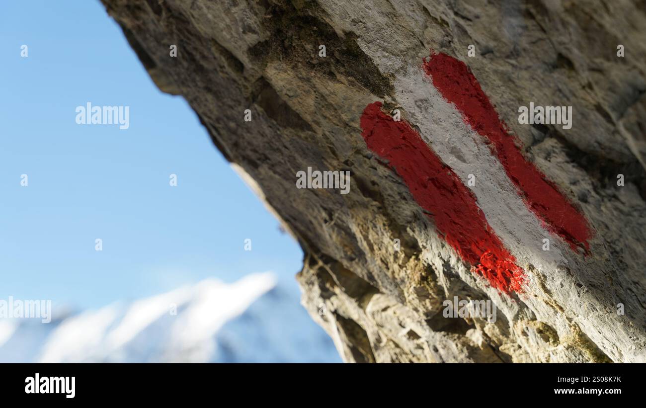 red white route marking on a hiking trail for navigation on a mountain ...