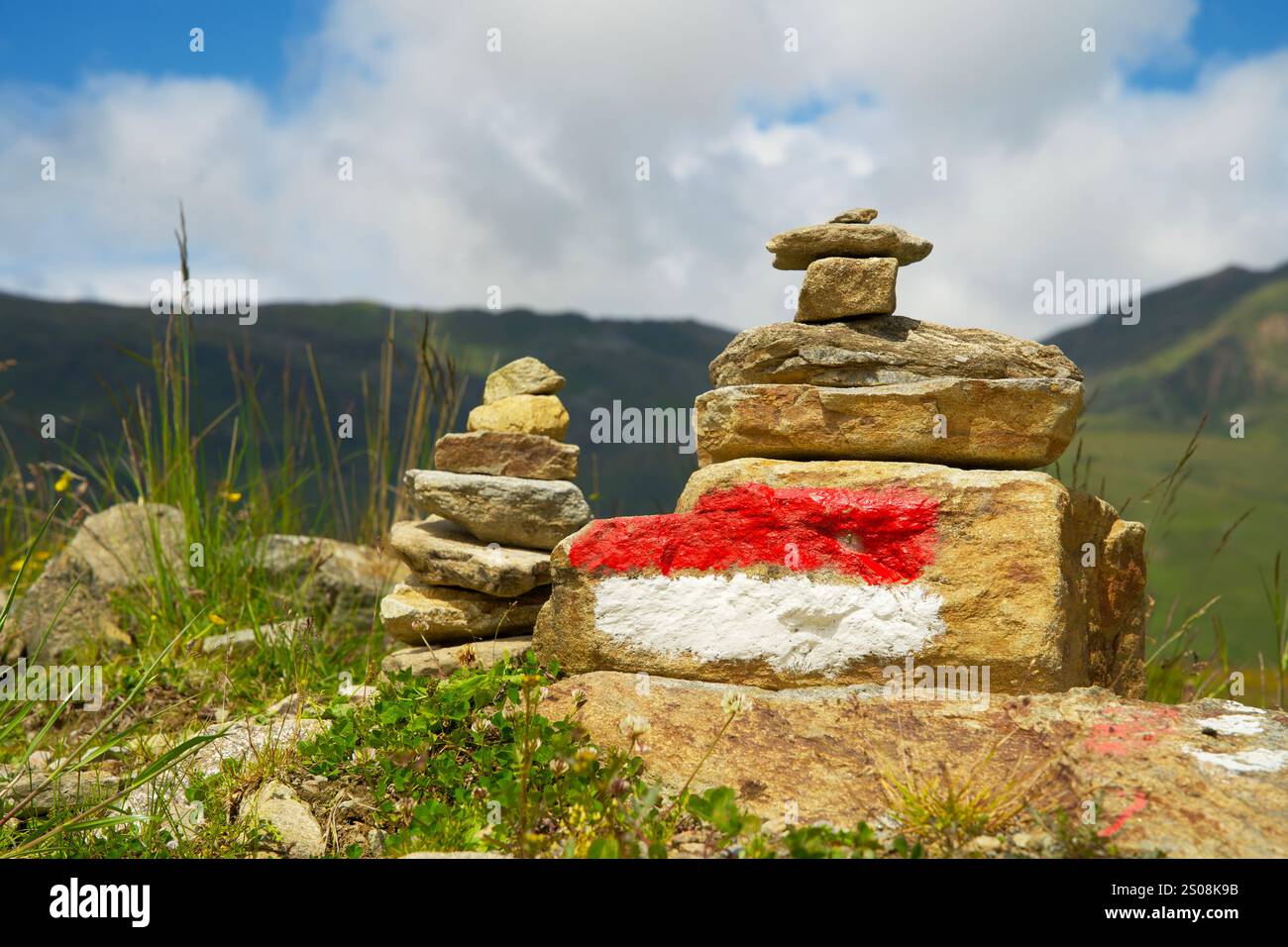 red white route marking on a hiking trail for navigation on a mountain ...