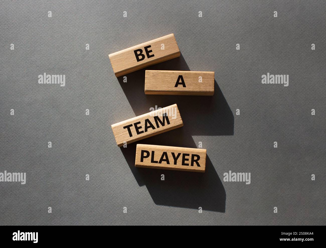 Be a team player symbol. Concept words Be a team player on wooden ...