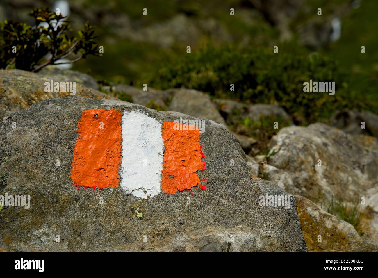 red white route marking on a hiking trail for navigation on a mountain ...