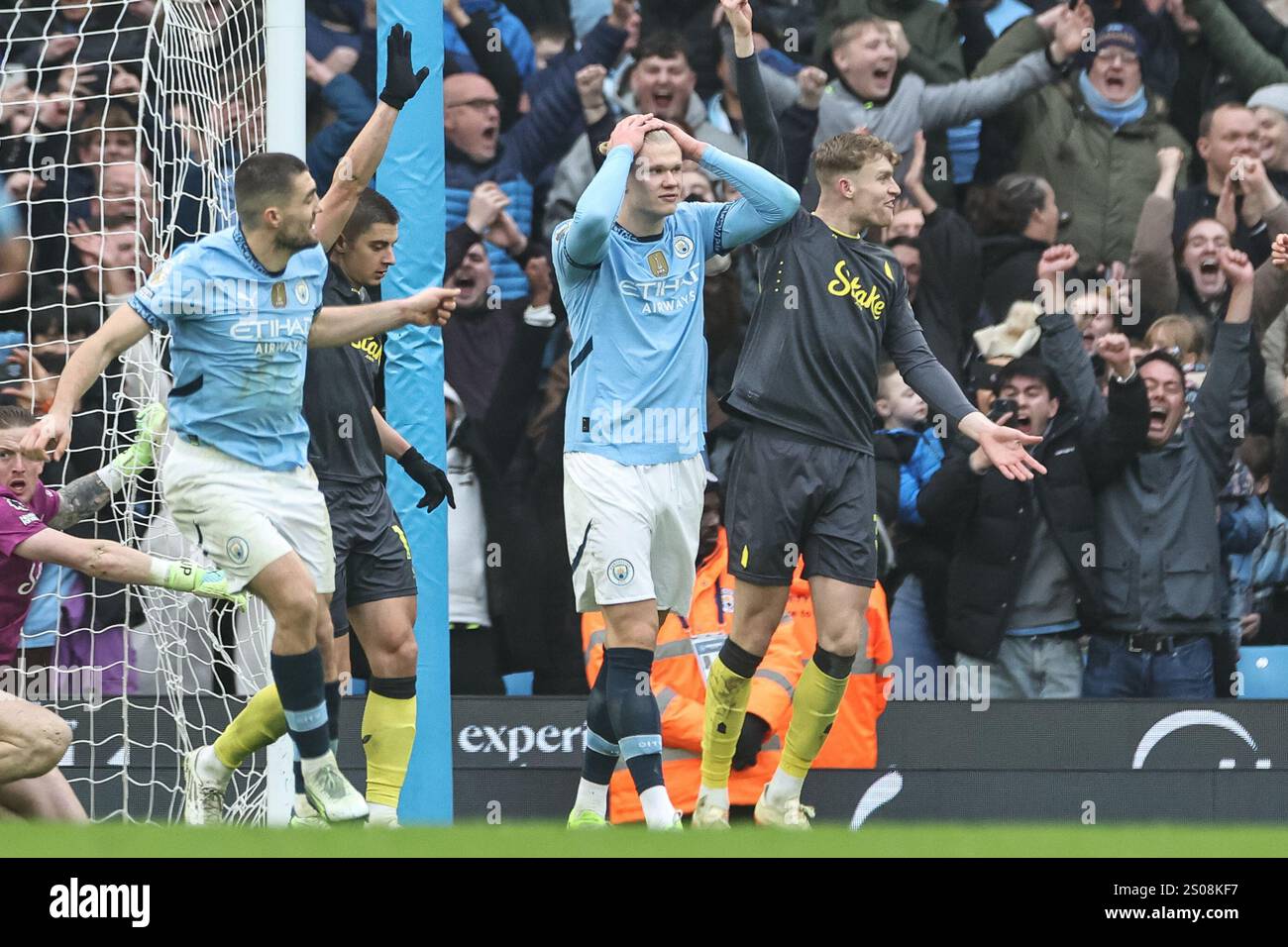 Erling Haaland of Manchester City reacts after his penalty rebound goal is given offside during ...