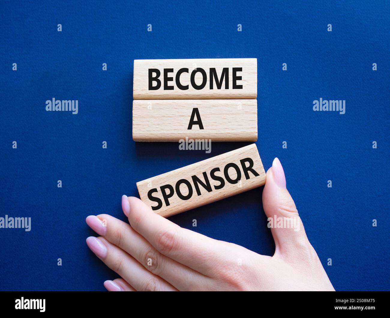 Become a sponsor symbol. Concept word Become a sponsor on wooden blocks ...